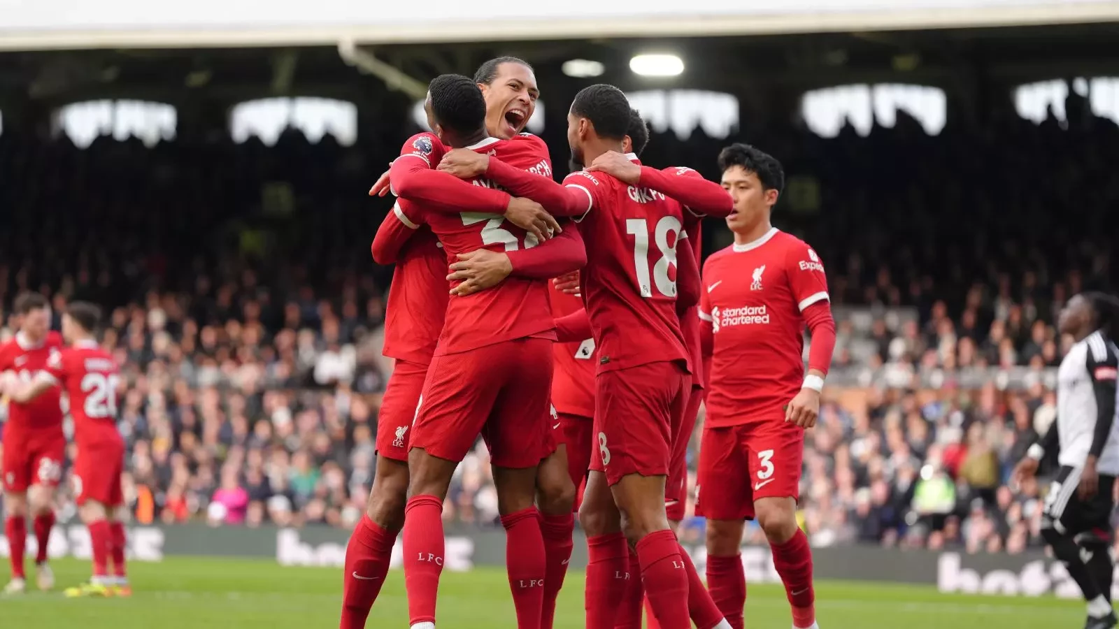 Liverpool down Fulham to move level on points at top of the table with ...